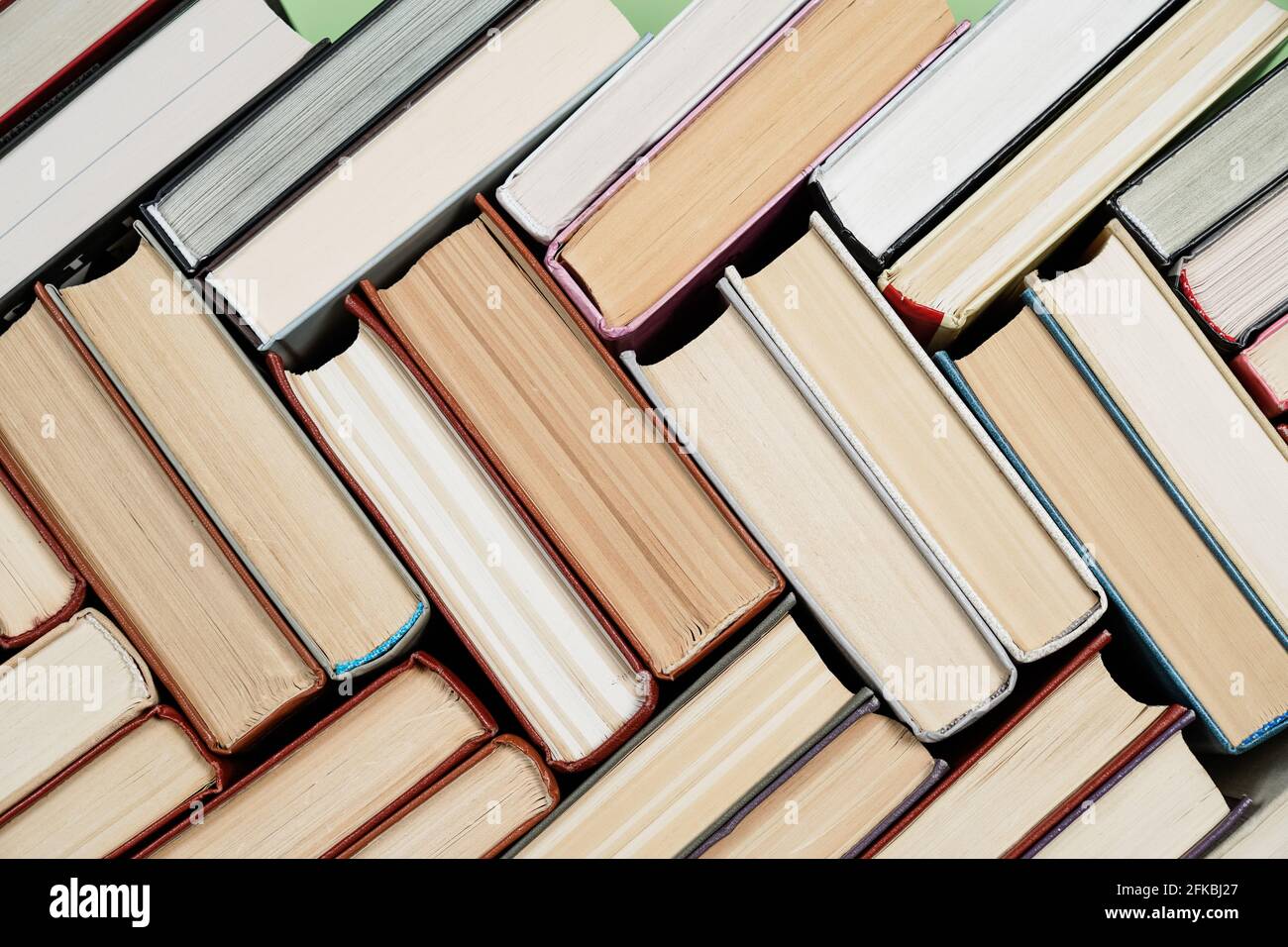 Many Books Piles. Hardback books on wooden table. Back to school. Copy ...
