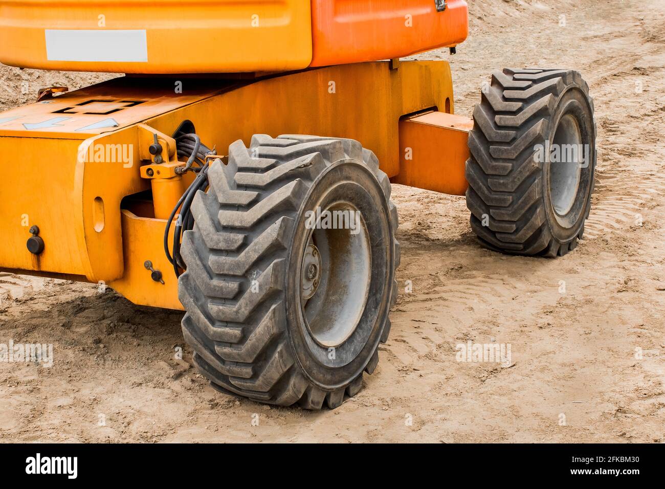 Wheels of industrial lifting transport tire truck against the ...