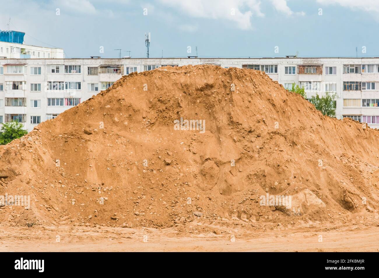 Large pile of sand nature material at a construction site against the ...