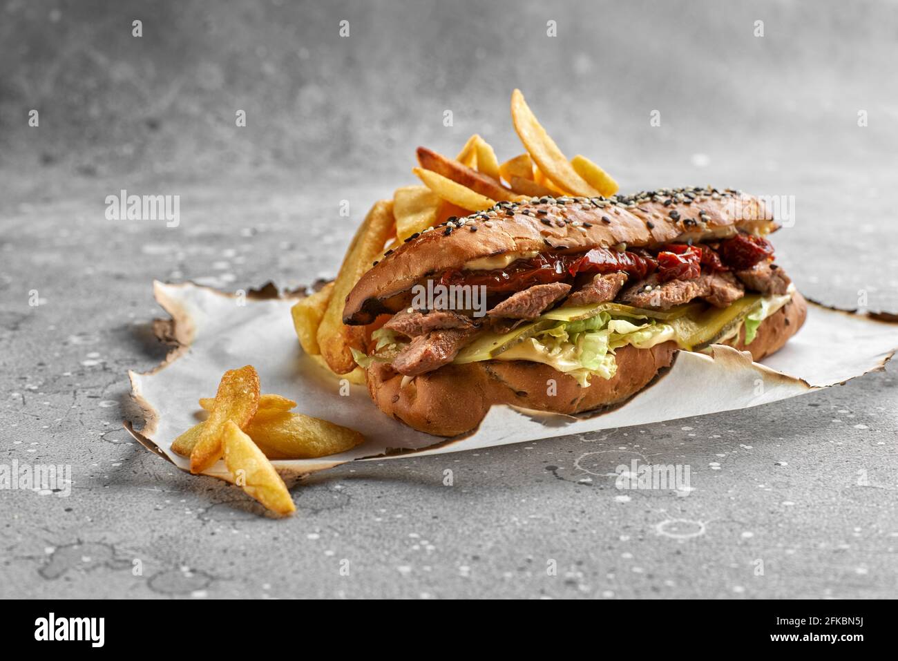 Croissant sandwich with grilled beef tenderloin, sun-dried tomatoes ...