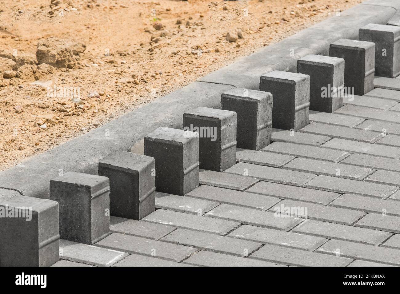 Laying floor tile sidewalk urban road or repairing paving stone slabs ...