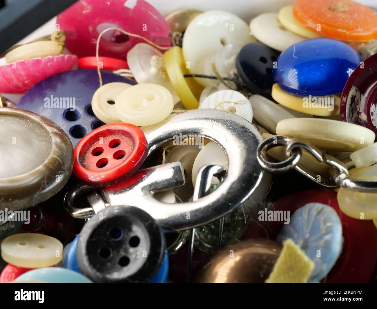 Collection of assorted spare clothes buttons. Macro. DOF Stock Photo ...