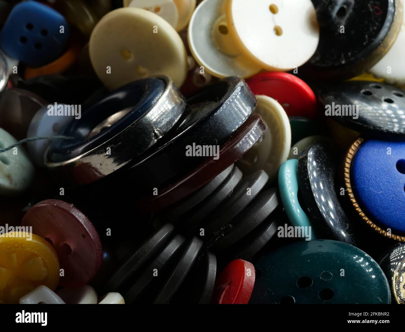 Collection of assorted spare clothes buttons. Macro. DOF Stock Photo ...