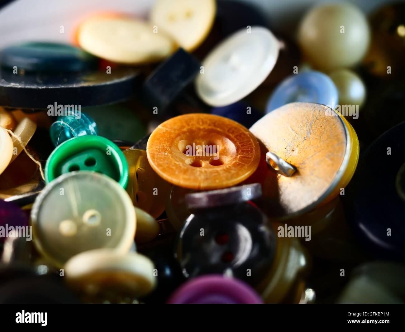 Collection of assorted spare clothes buttons. Macro. DOF Stock Photo ...