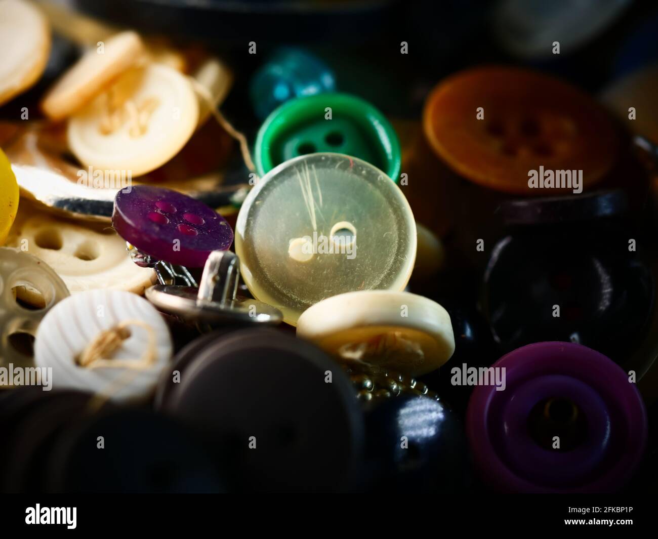 Collection of assorted spare clothes buttons. Macro. DOF Stock Photo ...