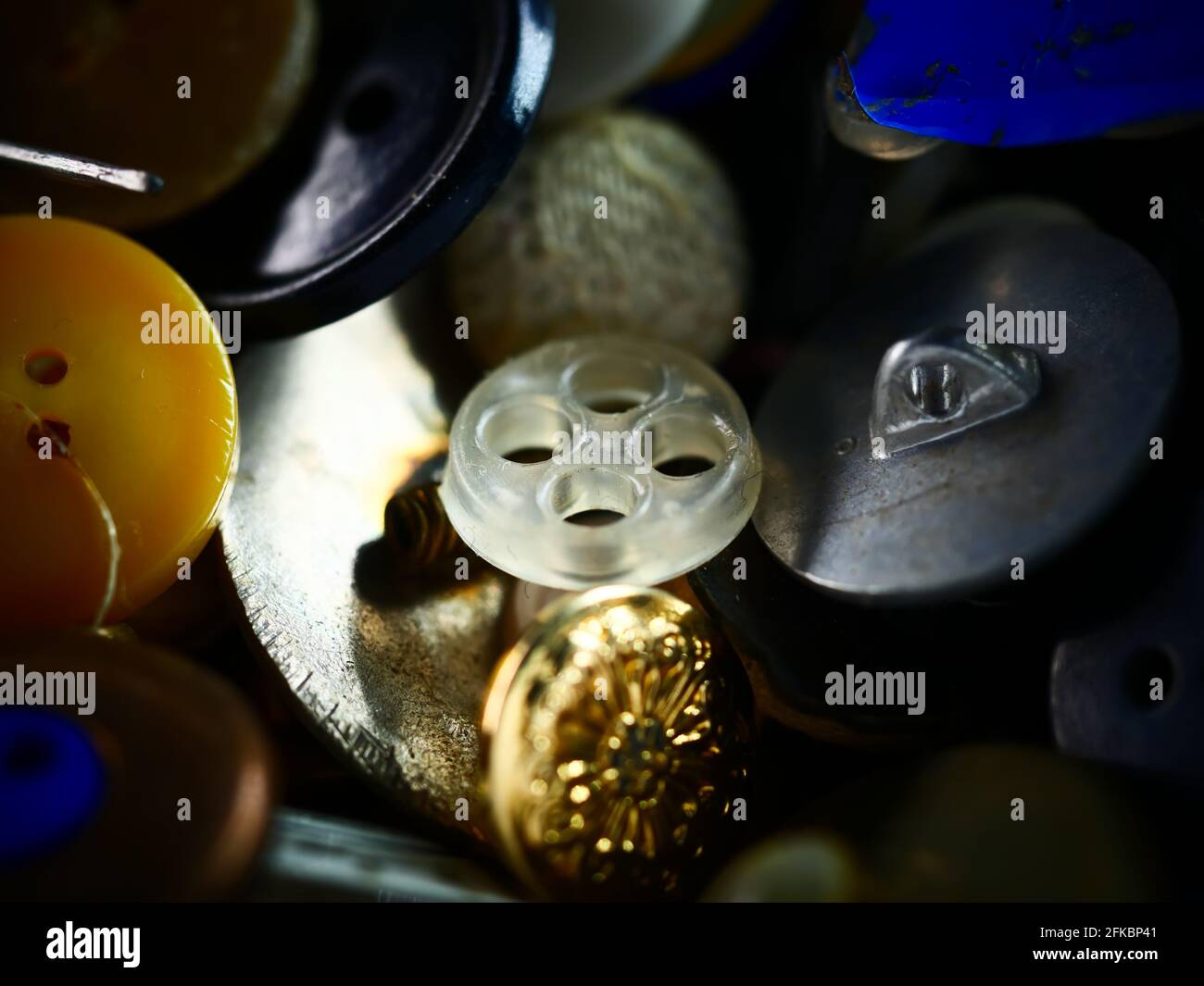 Collection of assorted spare clothes buttons. Macro. DOF Stock Photo ...