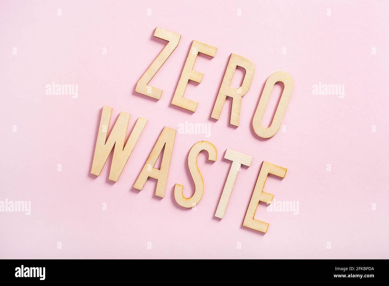 zero waste word text wooden letters on pink background Stock Photo - Alamy