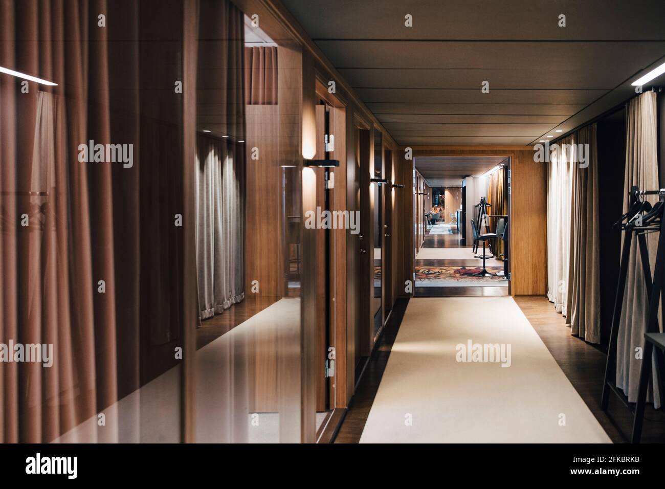 Illuminated corridor of modern office Stock Photo - Alamy