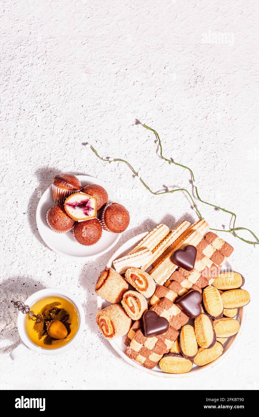 Good mood morning tea with various cookies and muffins. Fashionable ...