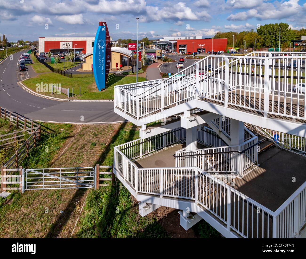 Suspension footbridge over the A45 at Rushden Lakes shopping ...