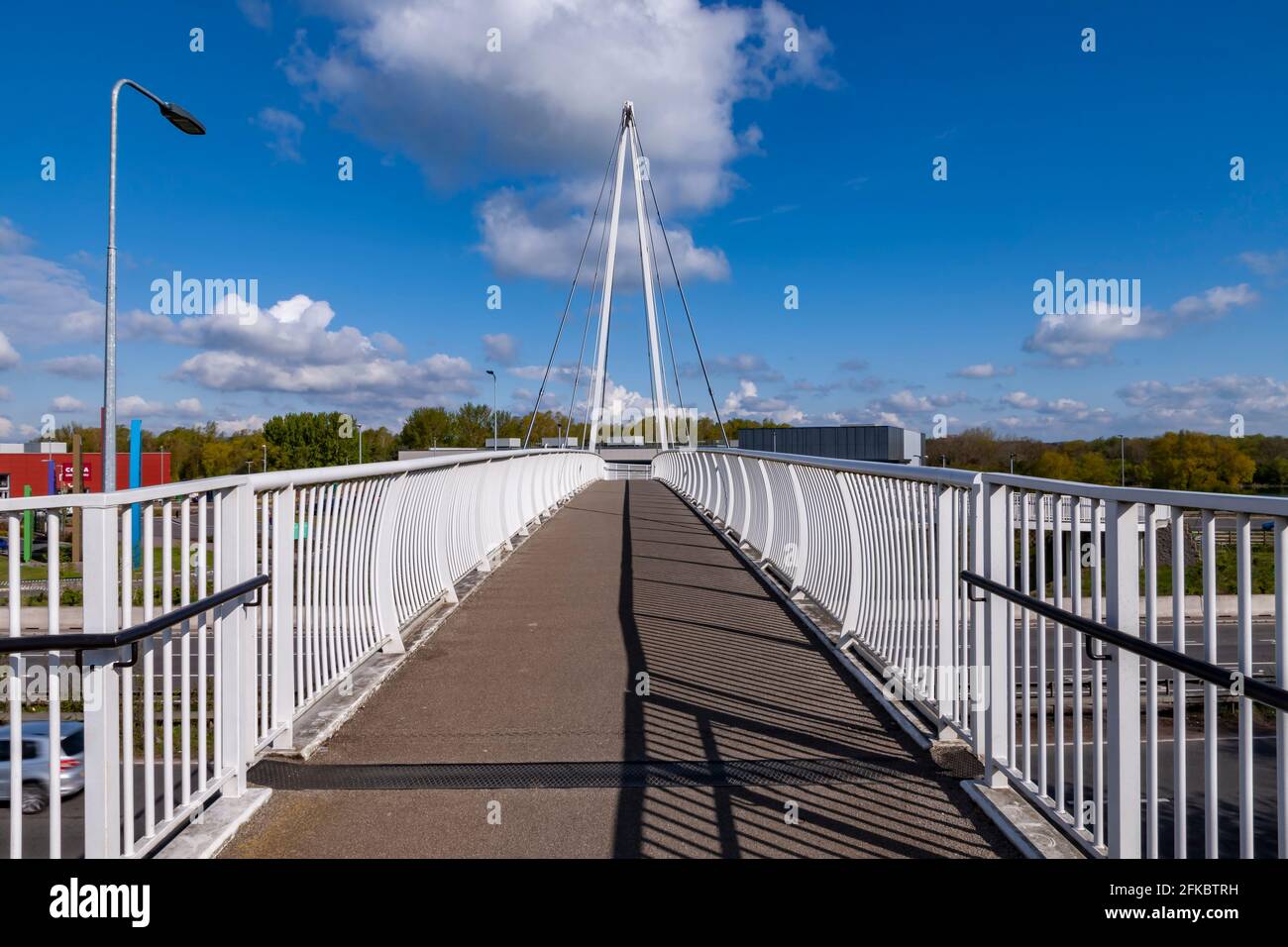 Suspension footbridge over the A45 at Rushden Lakes shopping ...