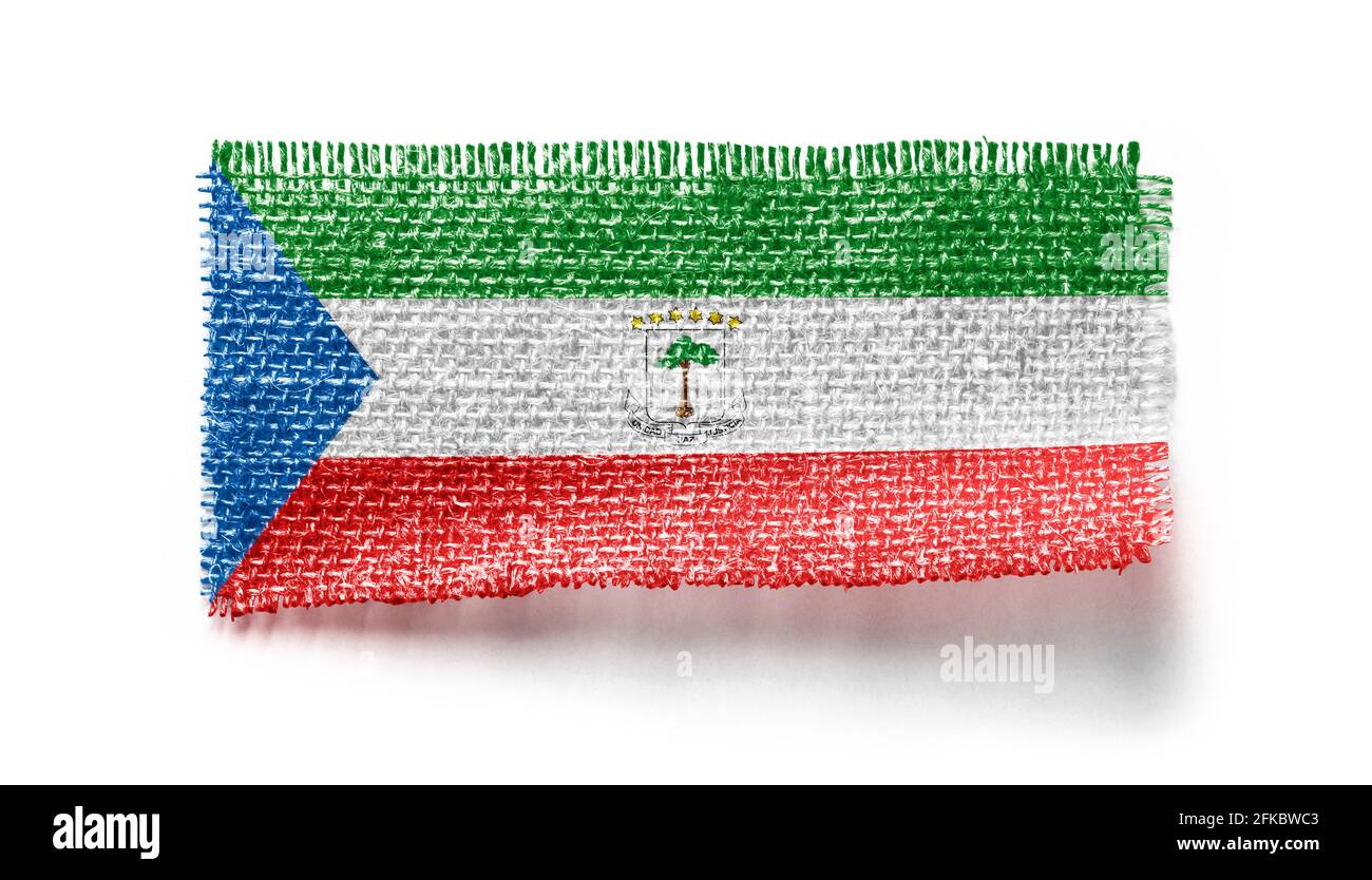 Equatorial Guinea flag on a piece of cloth on a white background Stock ...