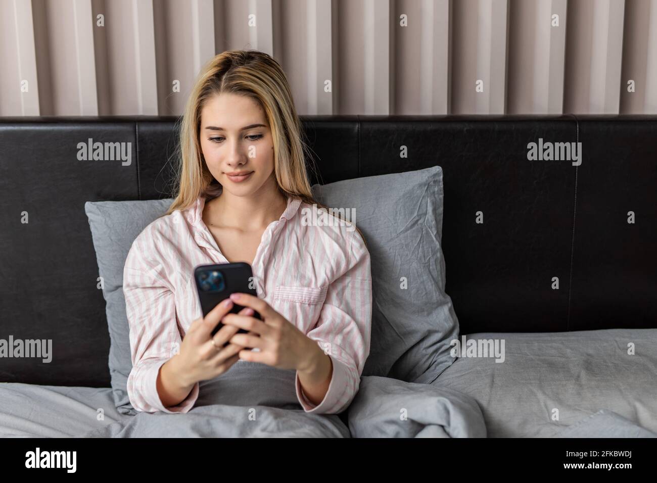 Portrait of young beautiful woman relax use smartphone gadget in ...