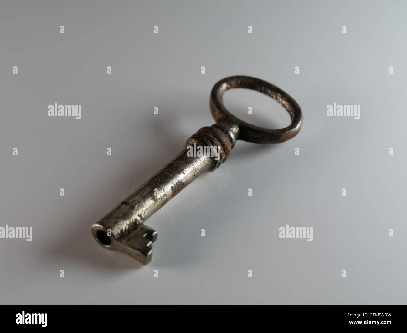 A golden key isolated on white background. Old rusty door key. Antique ...