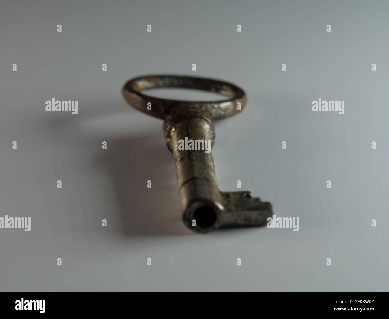 A golden key isolated on white background. Old rusty door key. Antique ...