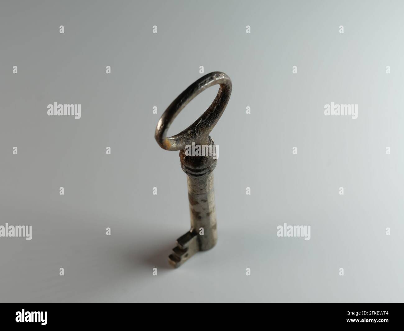 A golden key isolated on white background. Old rusty door key. Antique ...