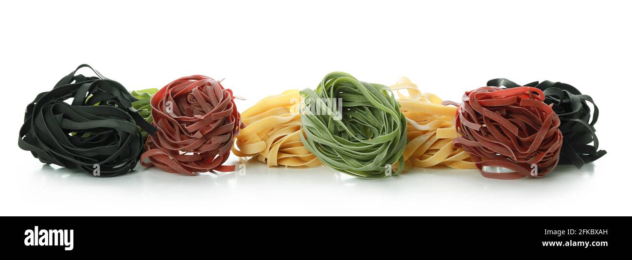 Uncooked color pasta isolated on white background Stock Photo - Alamy