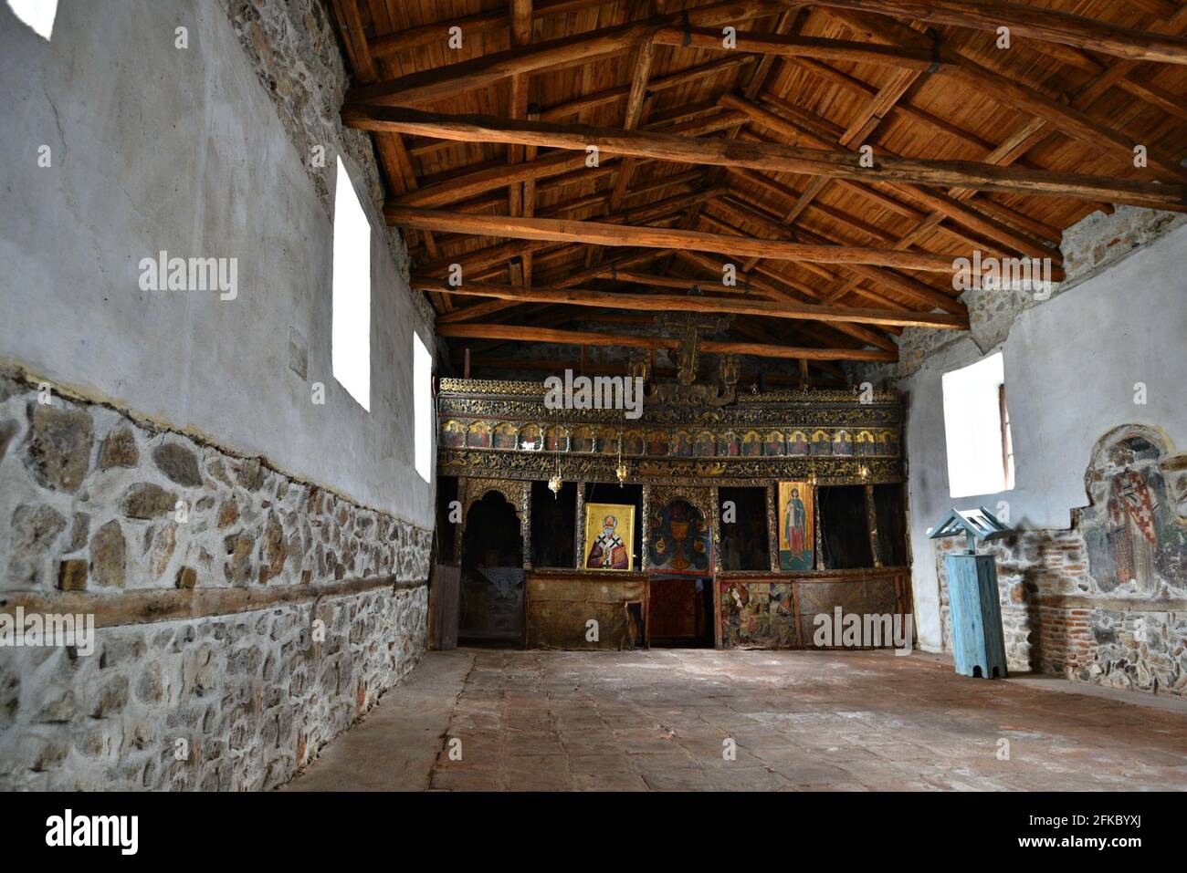 Ancient Byzantine church interior with frescoes and religious icons in ...