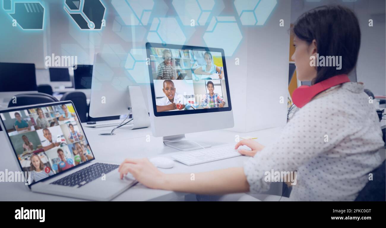 Composition of science icons over teacher and school children on ...