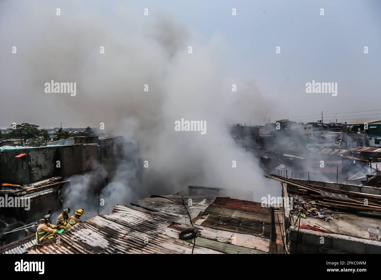 Manila, Philippines. 30th Apr, 2021. Firefighters try to put out a fire ...