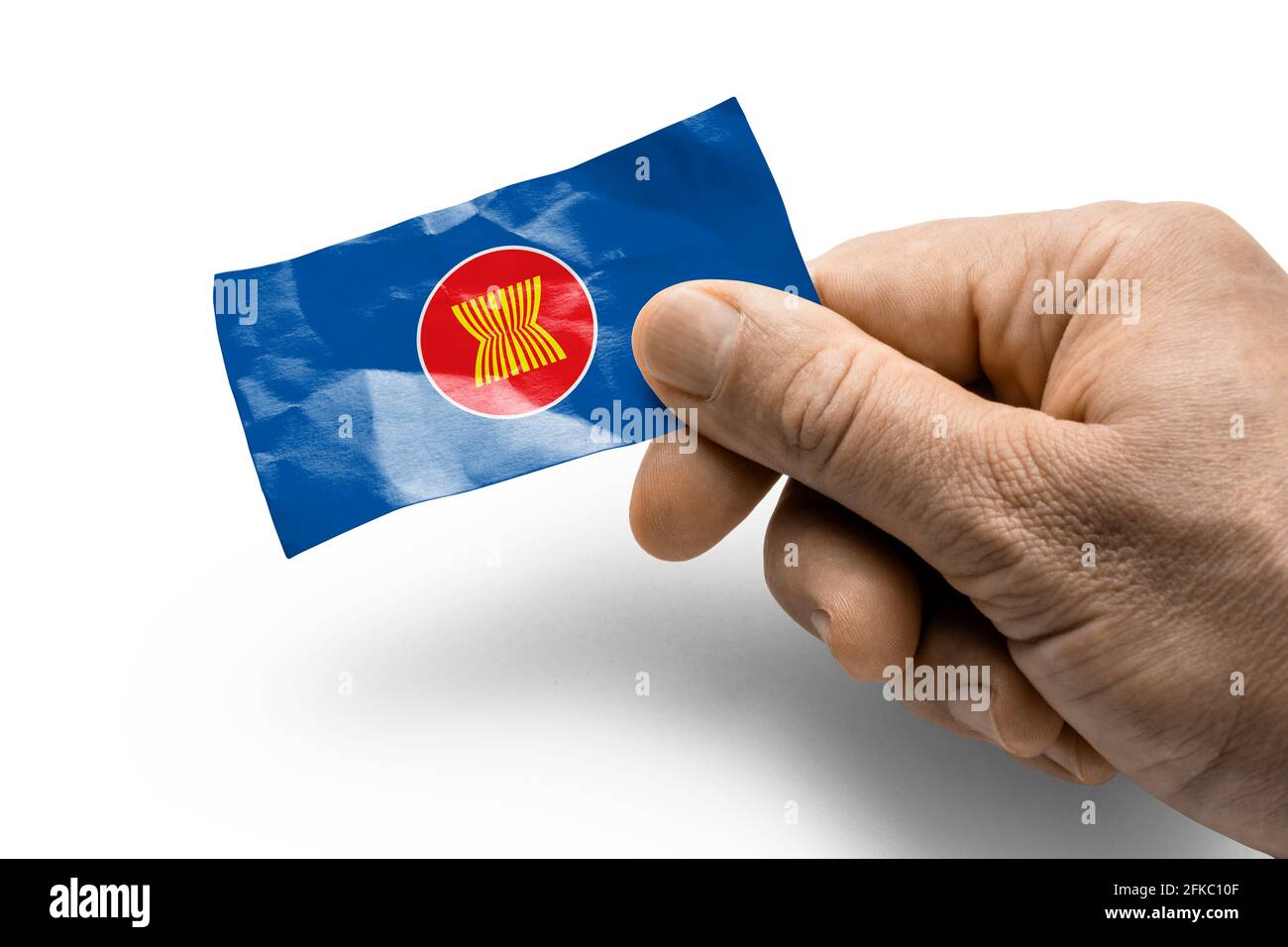 Hand holding a card with a national flag the ASEAN Stock Photo - Alamy