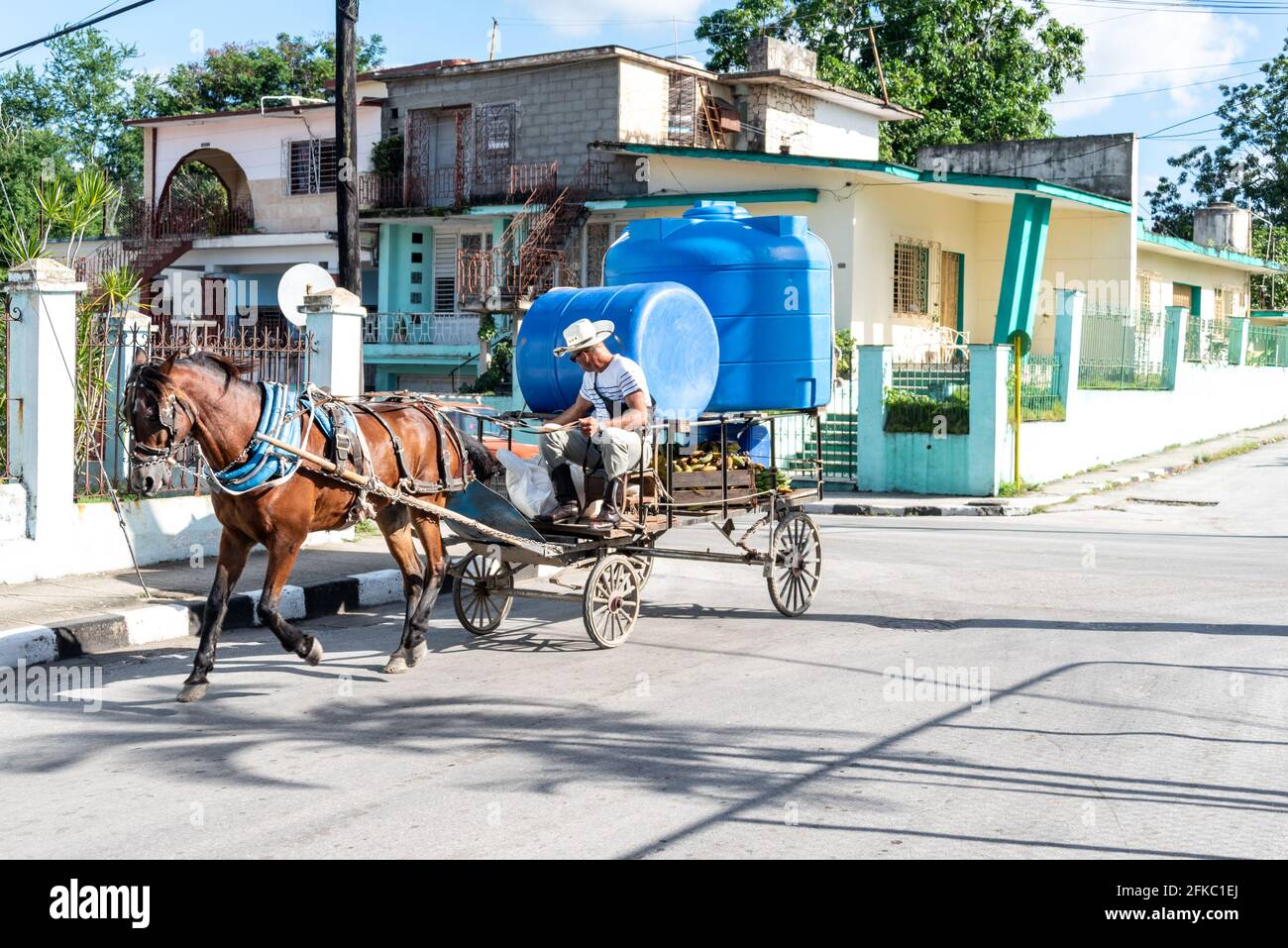 A man selling homemade plastic water storage tanks in Santa Clara, Cuba ...