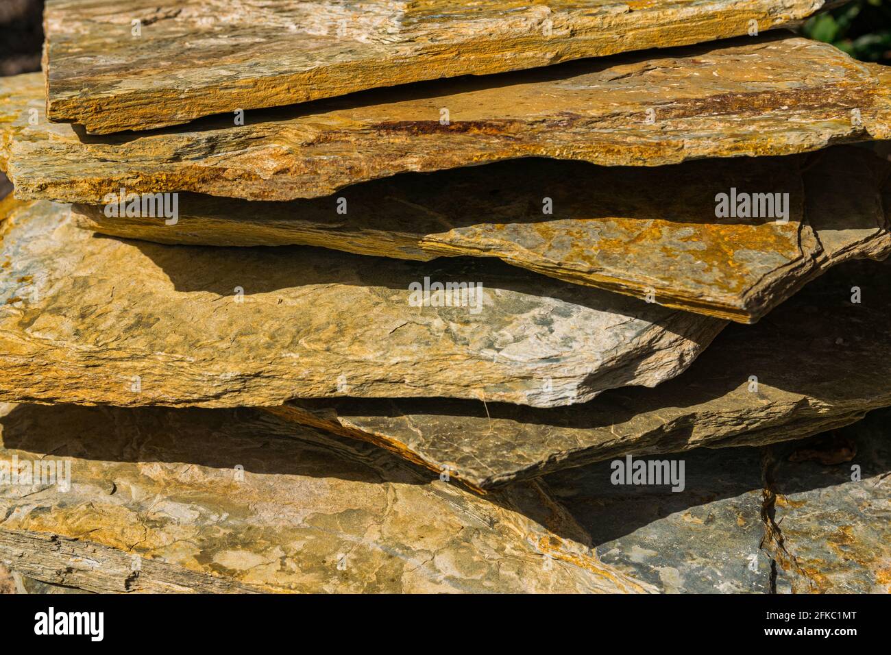 slate sheets, stacked and with sunlight, close view Stock Photo - Alamy
