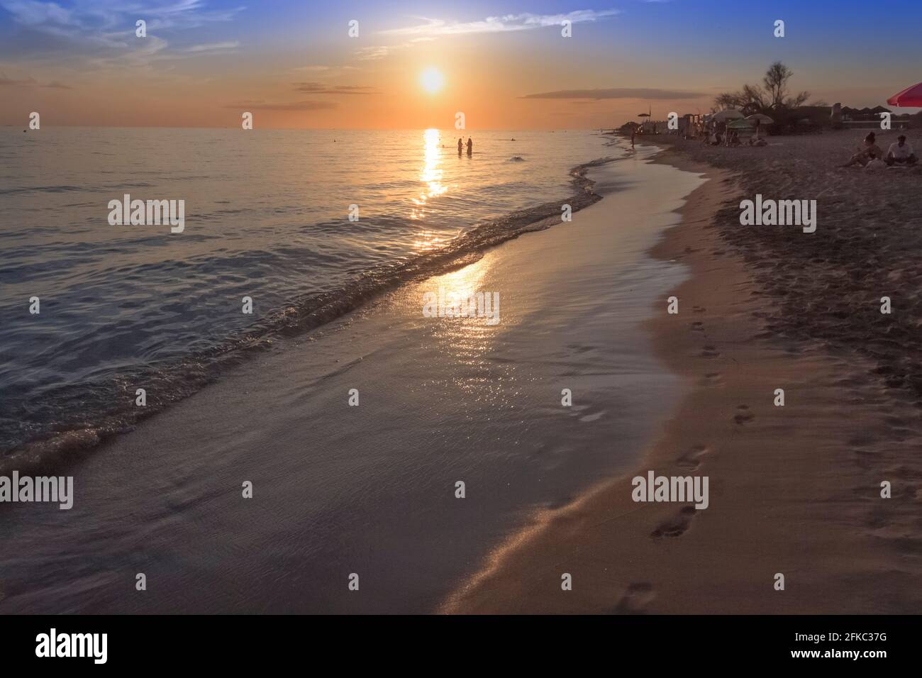 Summertime: beach sunset. Torre Mozza Beach is one of the longest and ...
