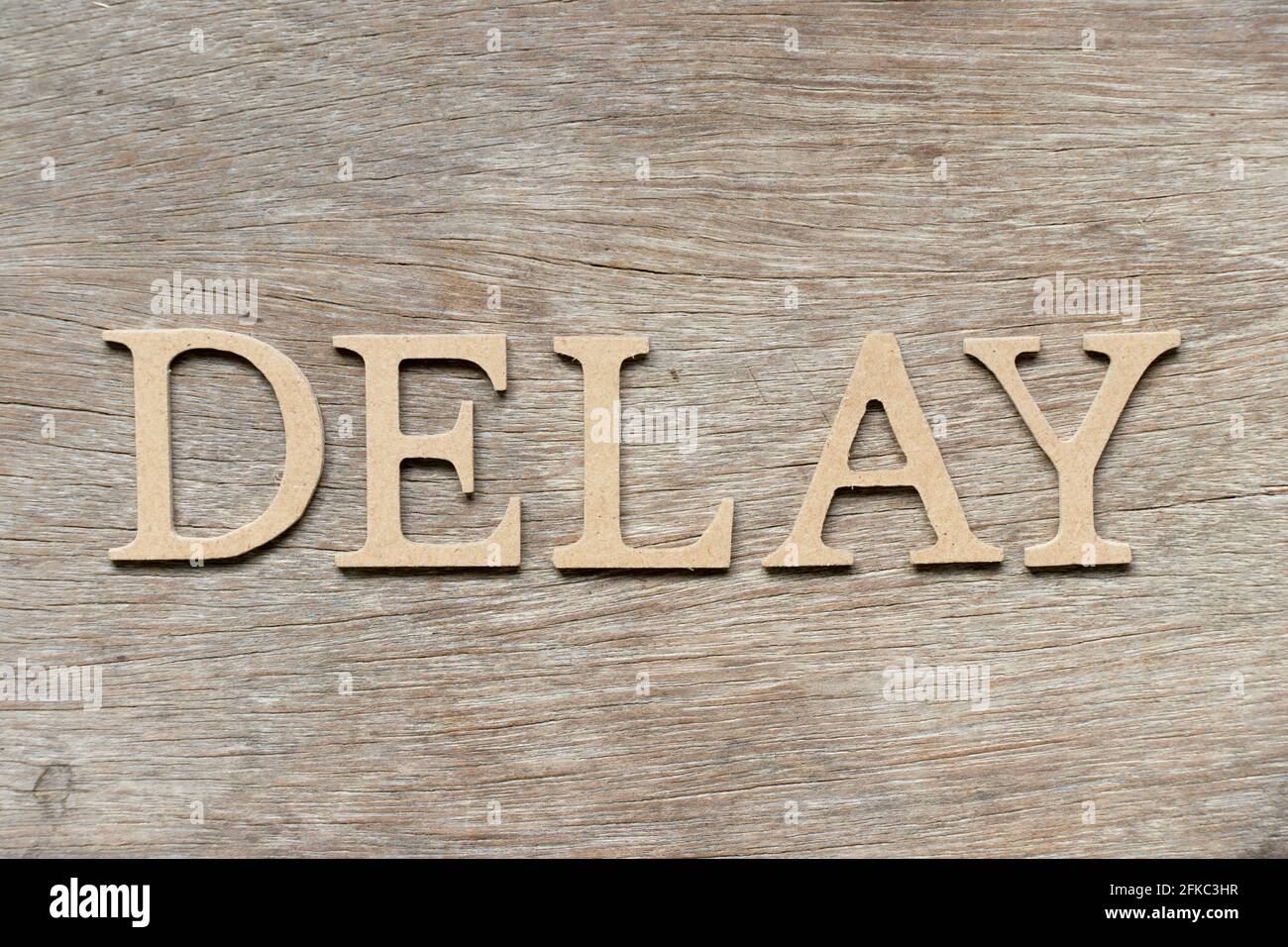 Alphabet letter in word delay on wood background Stock Photo - Alamy