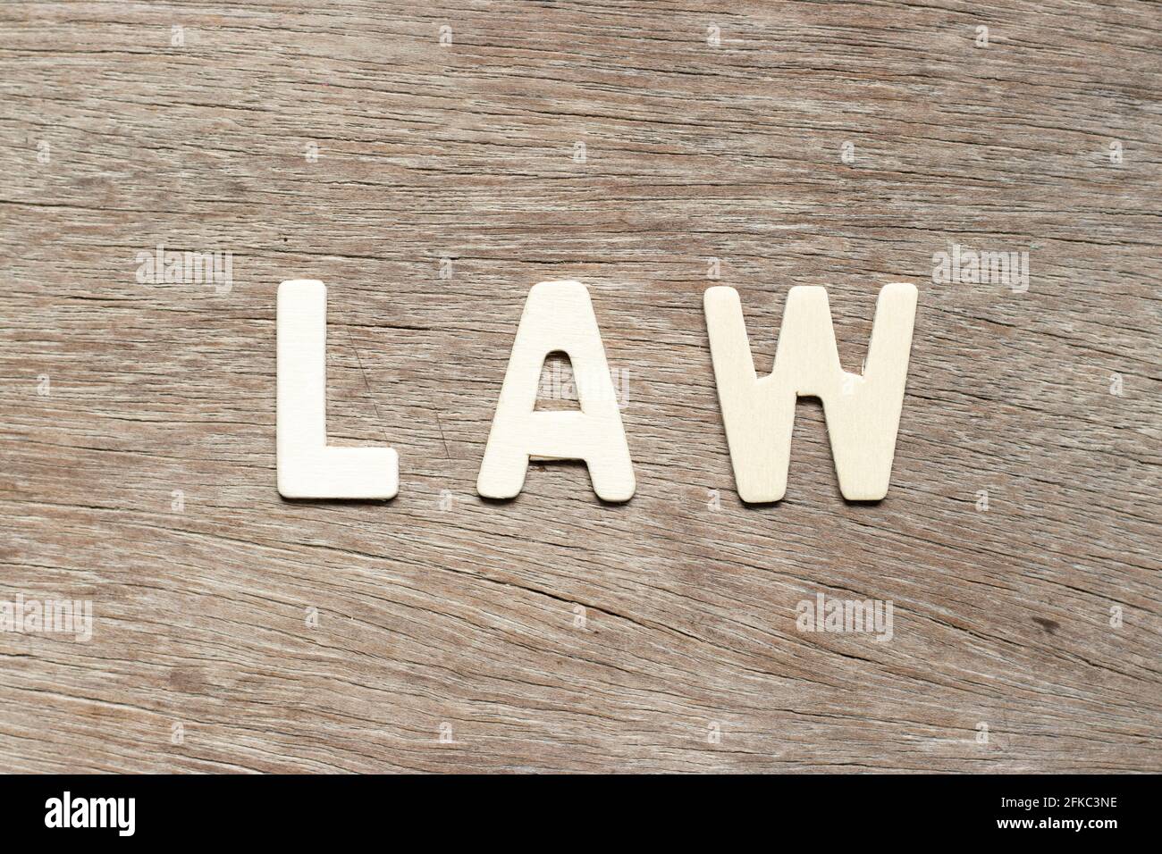 Alphabet letter in word law on wood background Stock Photo - Alamy