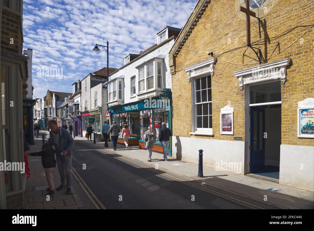 Shoppers walking past Harbour church in Harbour Street, Whitstable on a ...