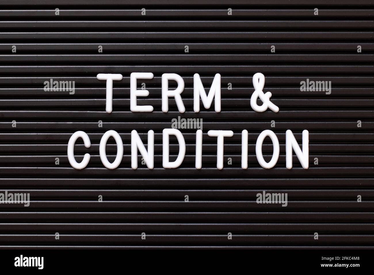 Black color felt letter board with white alphabet in word term ...