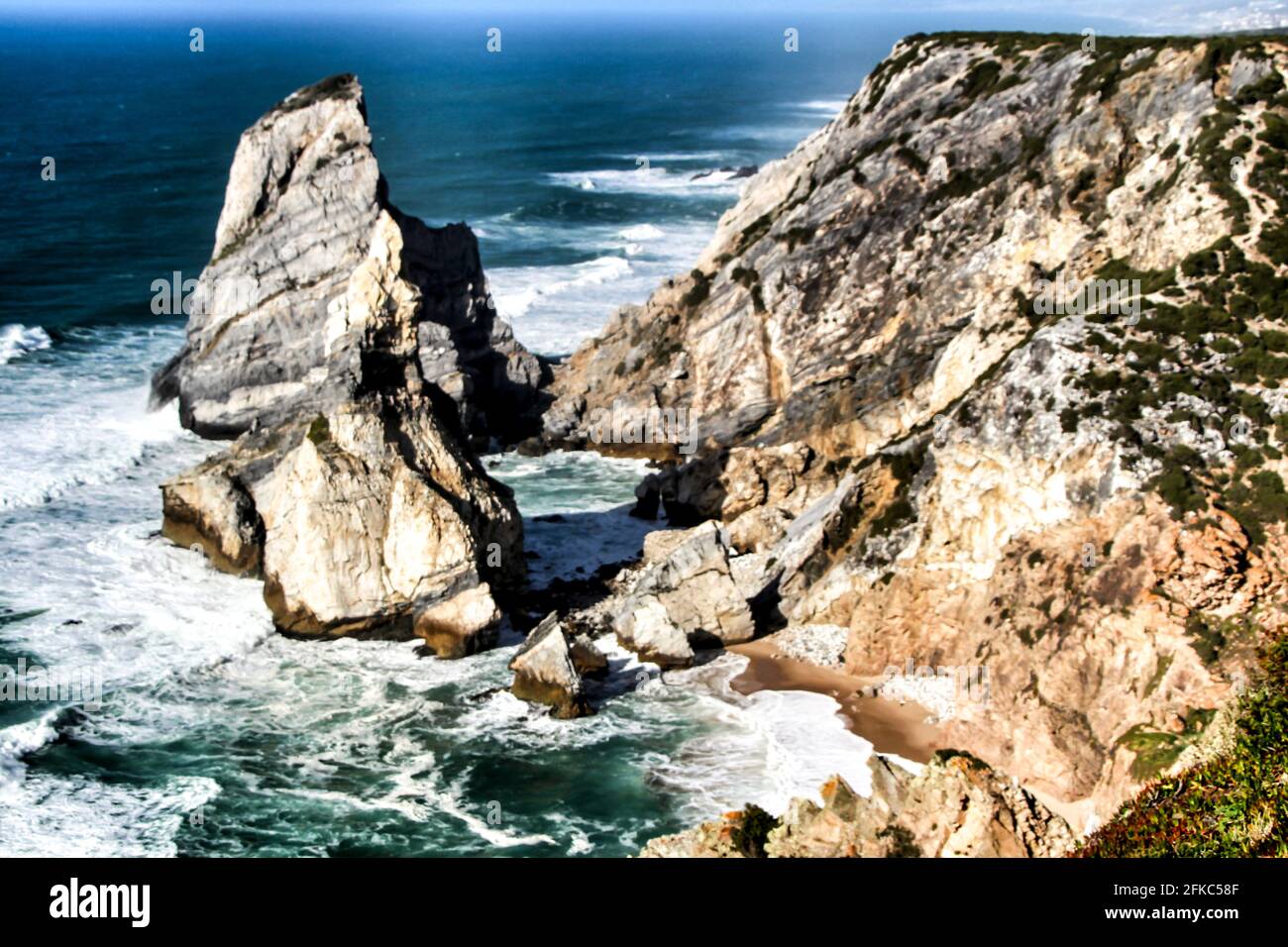 Beautiful Ursa beach with its colossal rock formations and the blue ...