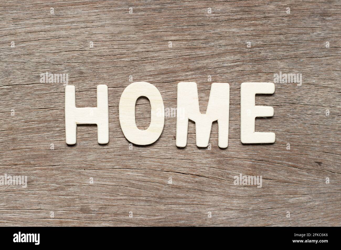 Alphabet letter in word home on wood background Stock Photo - Alamy