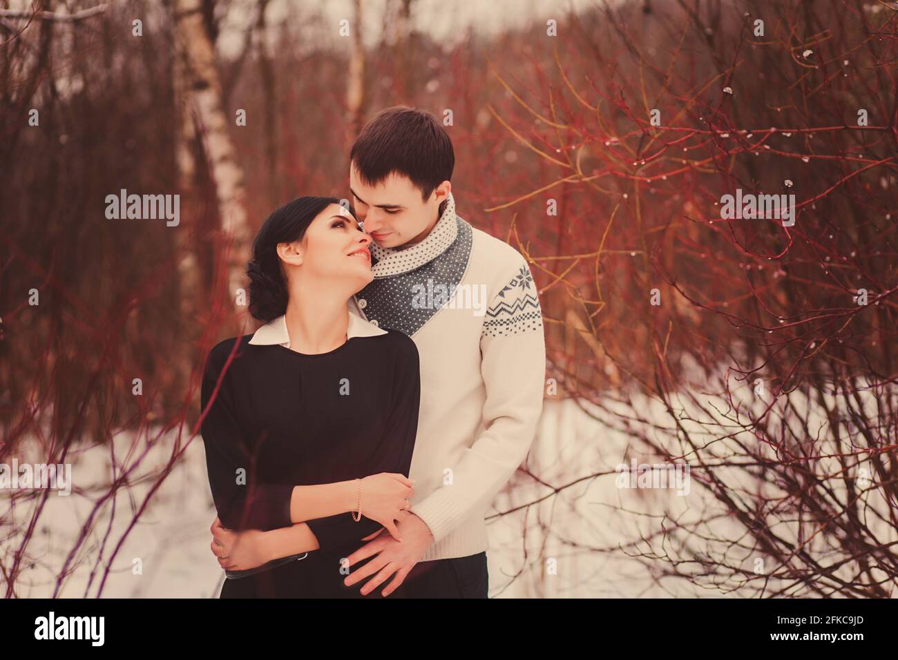 Positive couple in the forest. Looking at each other. Happy moment ...