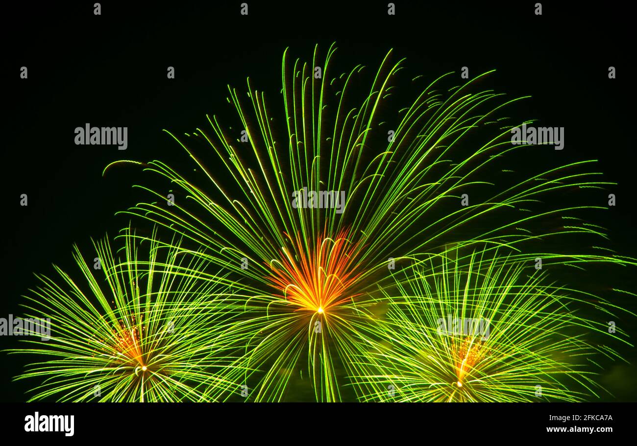 Gold and green fireworks in the night sky hi-res stock photography and ...
