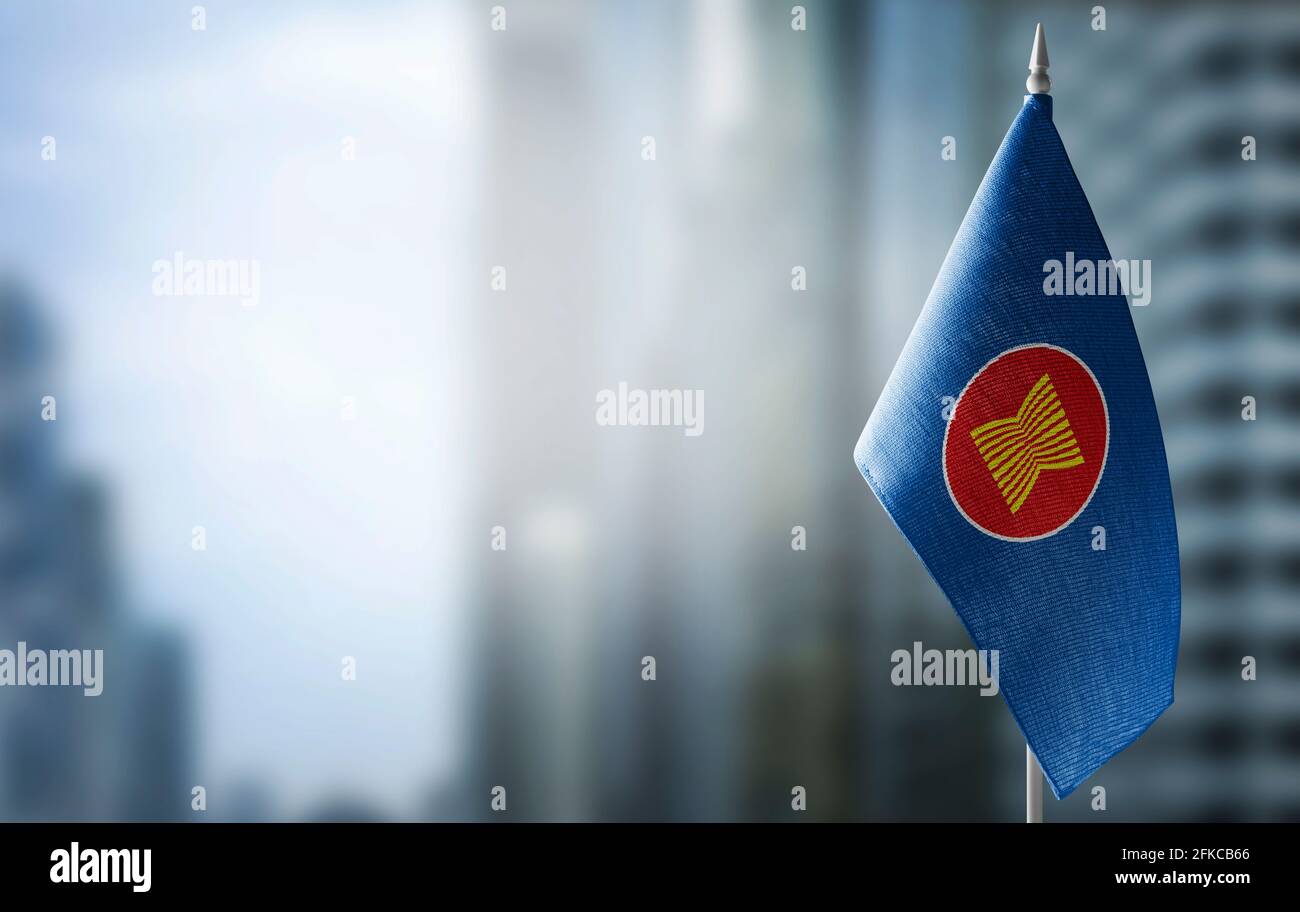 A small flag of ASEAN on the background of a blurred background Stock ...