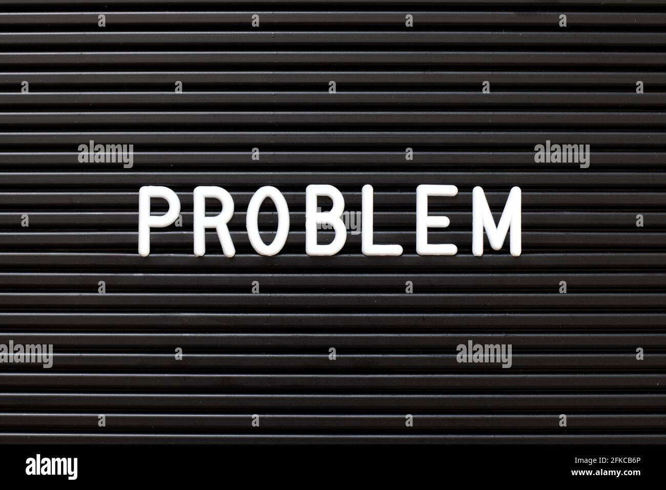 Black color felt letter board with white alphabet in word problem ...