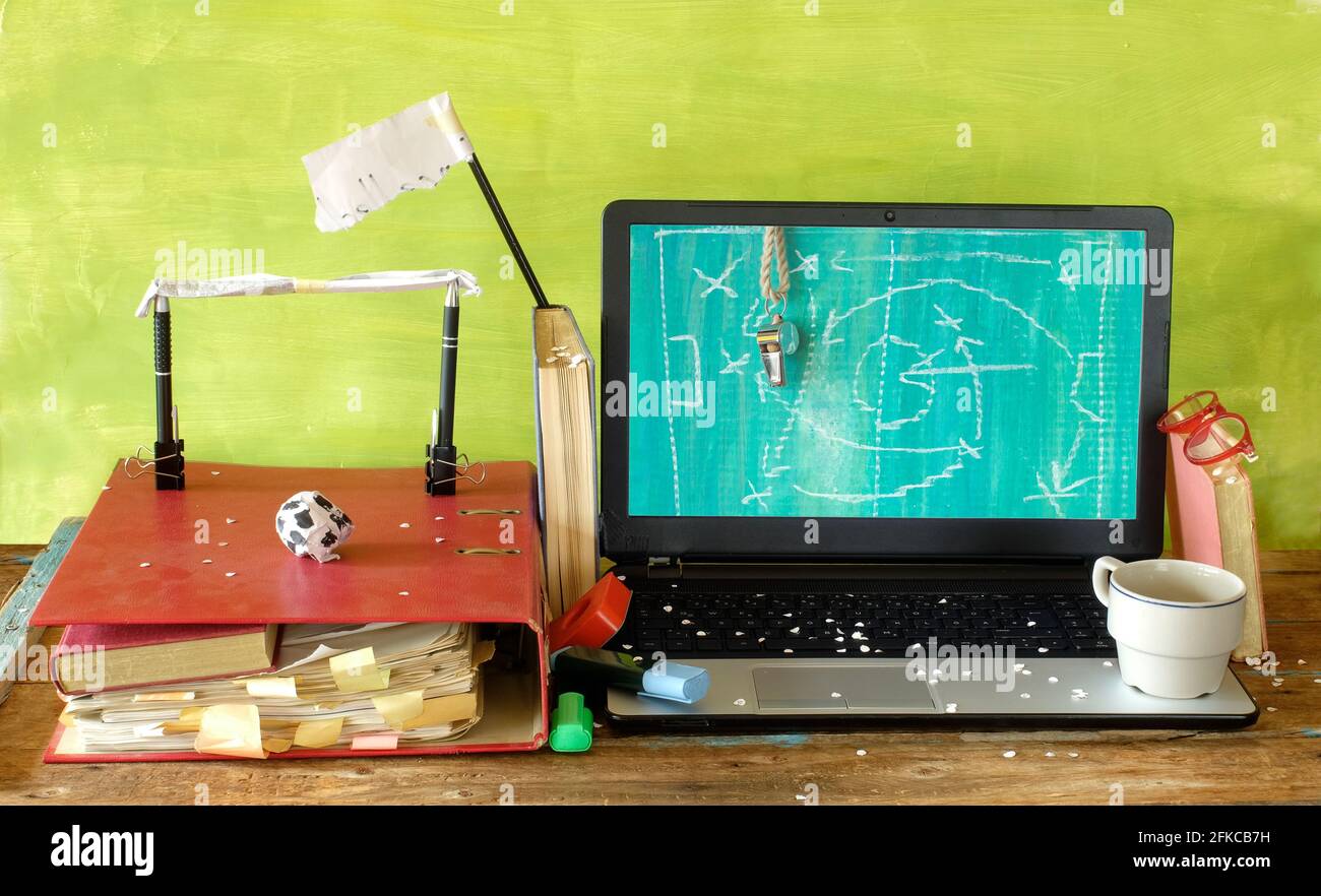 Celebrating soccer sport in the office,workplace with varoius soccer or ...