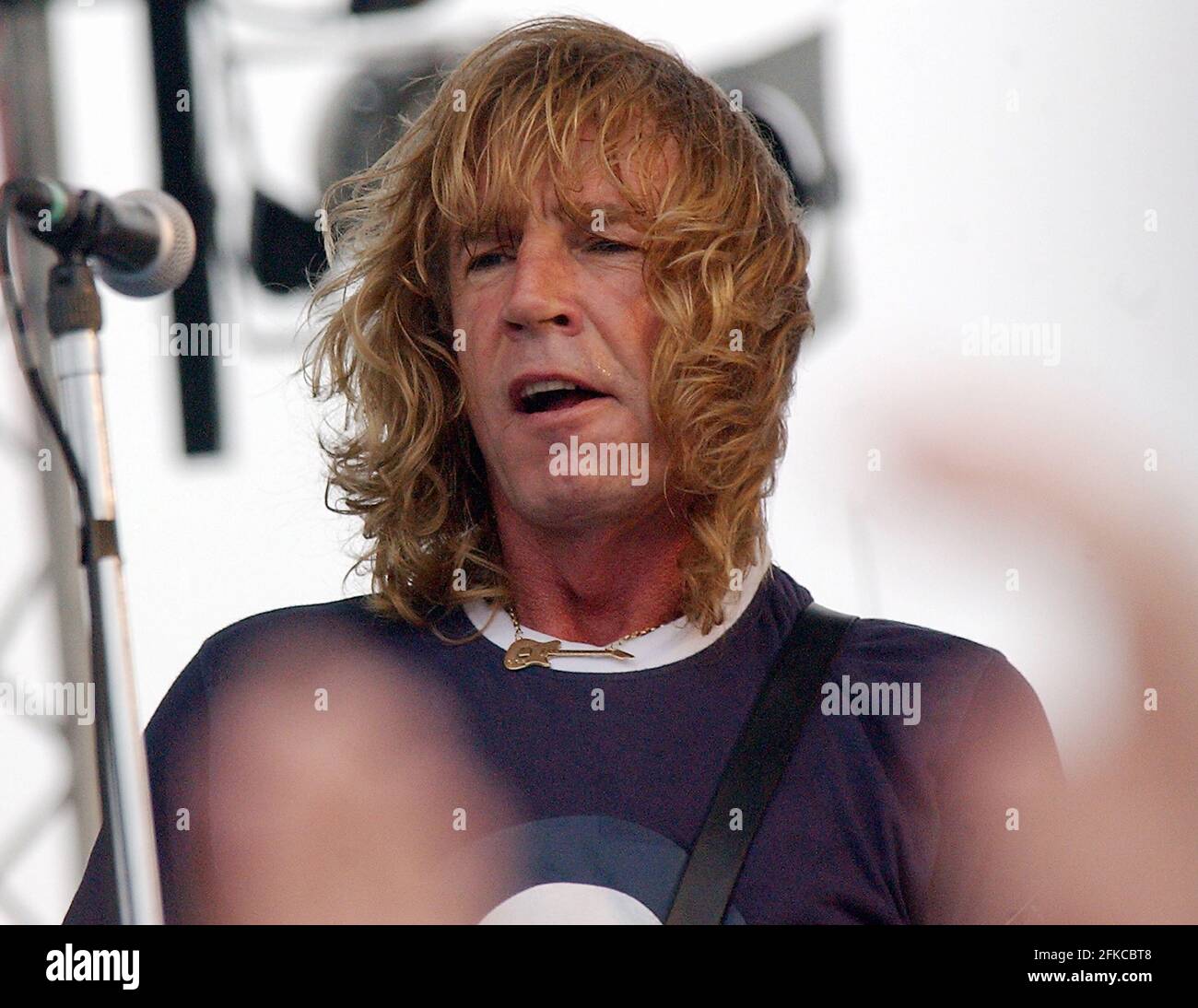 RICK PARFITT ON STAGE ABOARD HMS ARK ROYAL AT PORTSMOUTH WHERE THE BAND ...