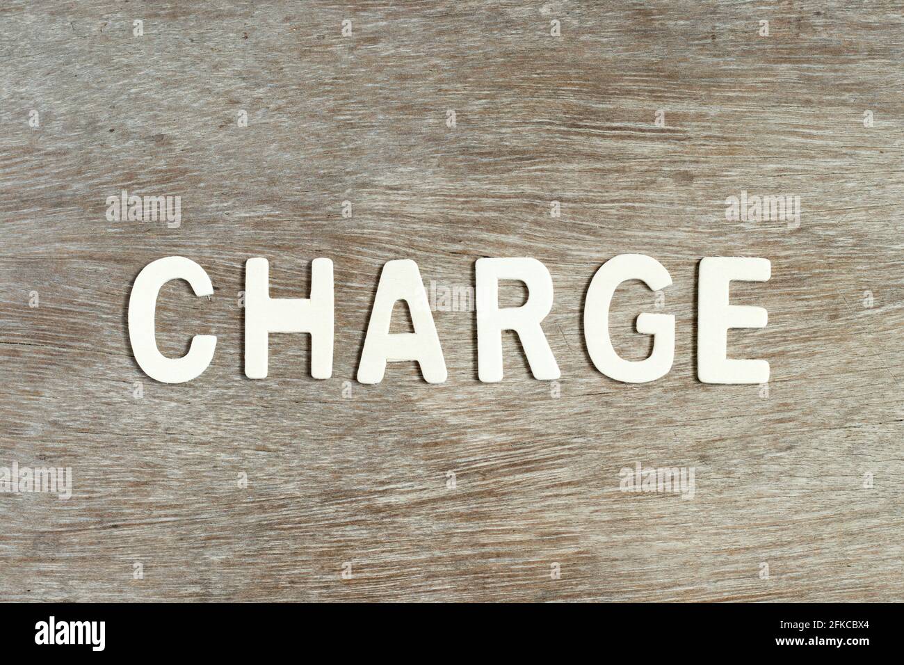 Alphabet letter in word charge on wood background Stock Photo - Alamy