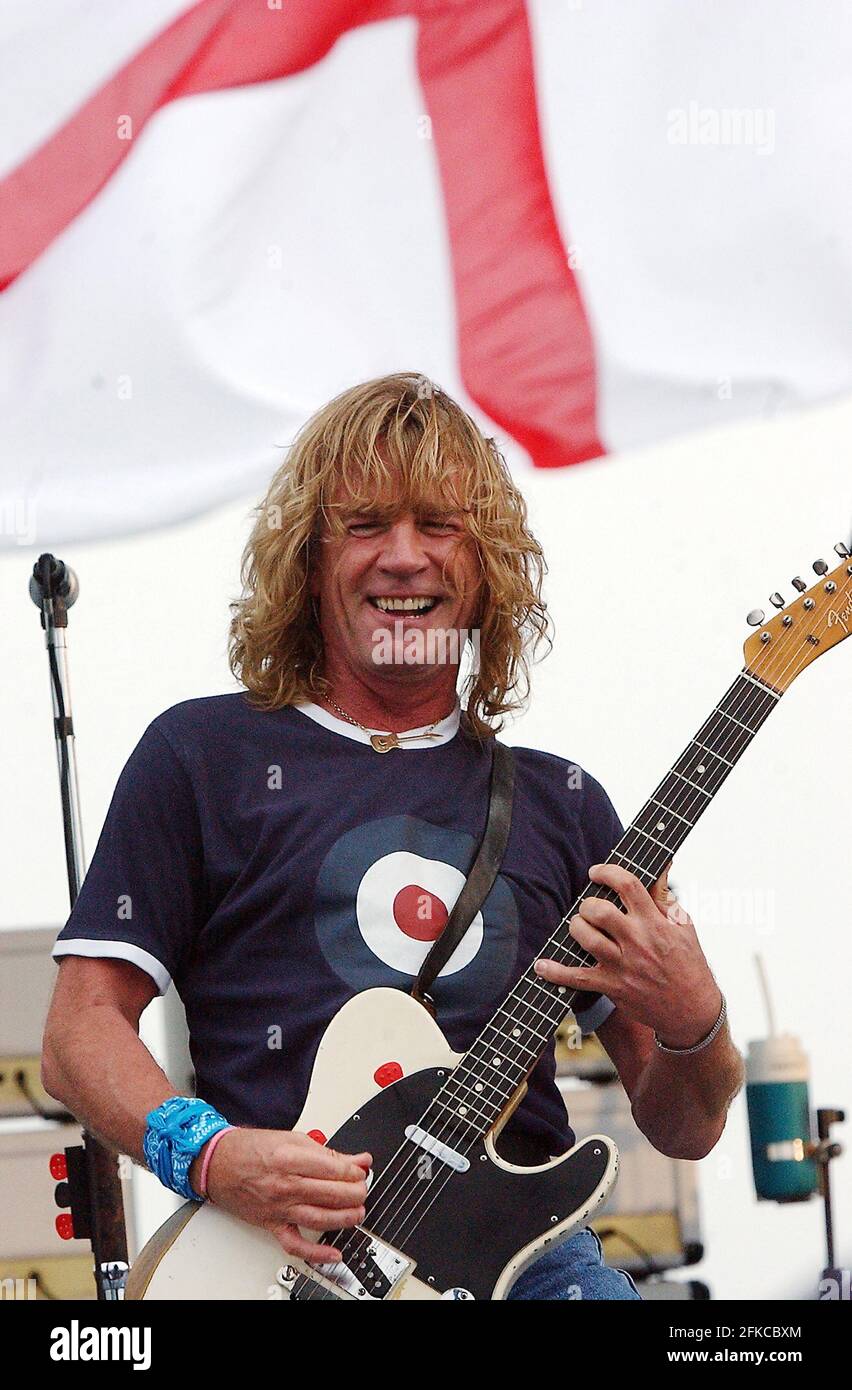 STATUS QUO'S RICK PARFITT ON STAGE ABOARD HMS ARK ROYAL AT PORTSMOUTH ...