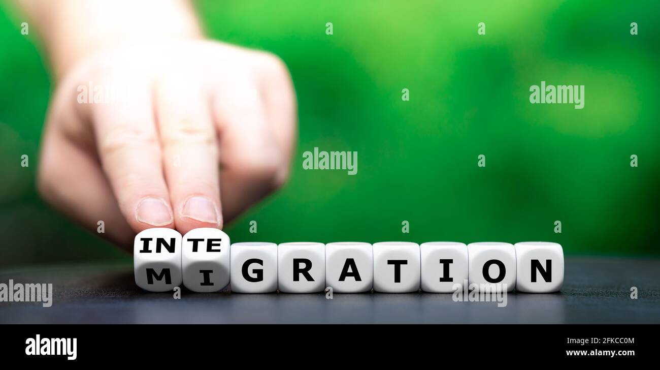 Hand´ turns dice and changes the word "migration" to "integration Stock ...