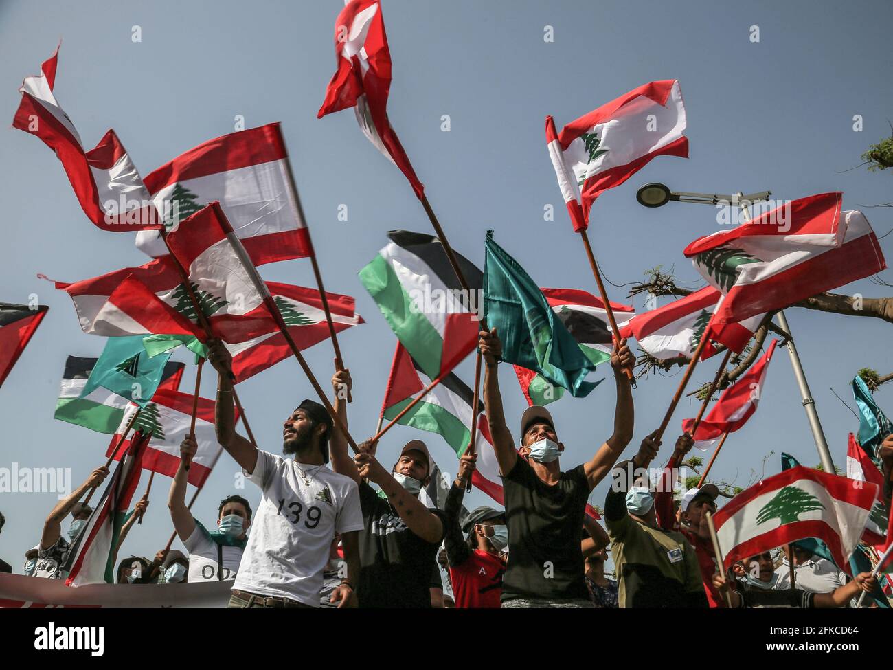 Beirut, Lebanon. 30th Apr, 2021. Pro-Iranian Hezbollah supporters wave ...