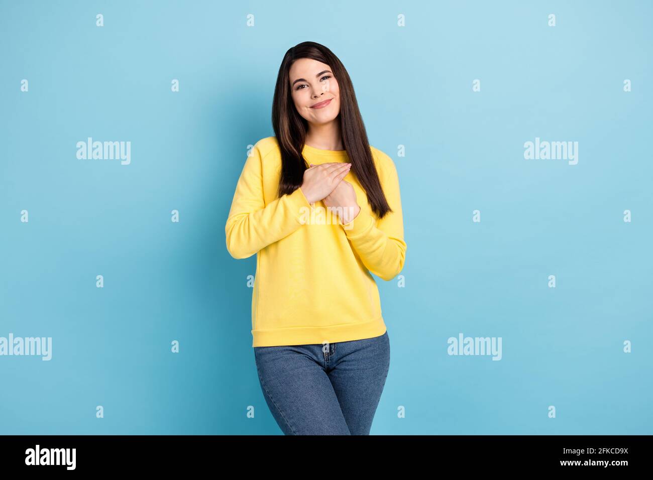 Photo Of Nice Optimistic Brunette Long Hairdo Lady Hands On Chest Wear