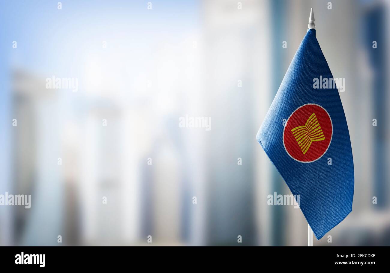 A small flag of ASEAN on the background of a blurred background Stock ...
