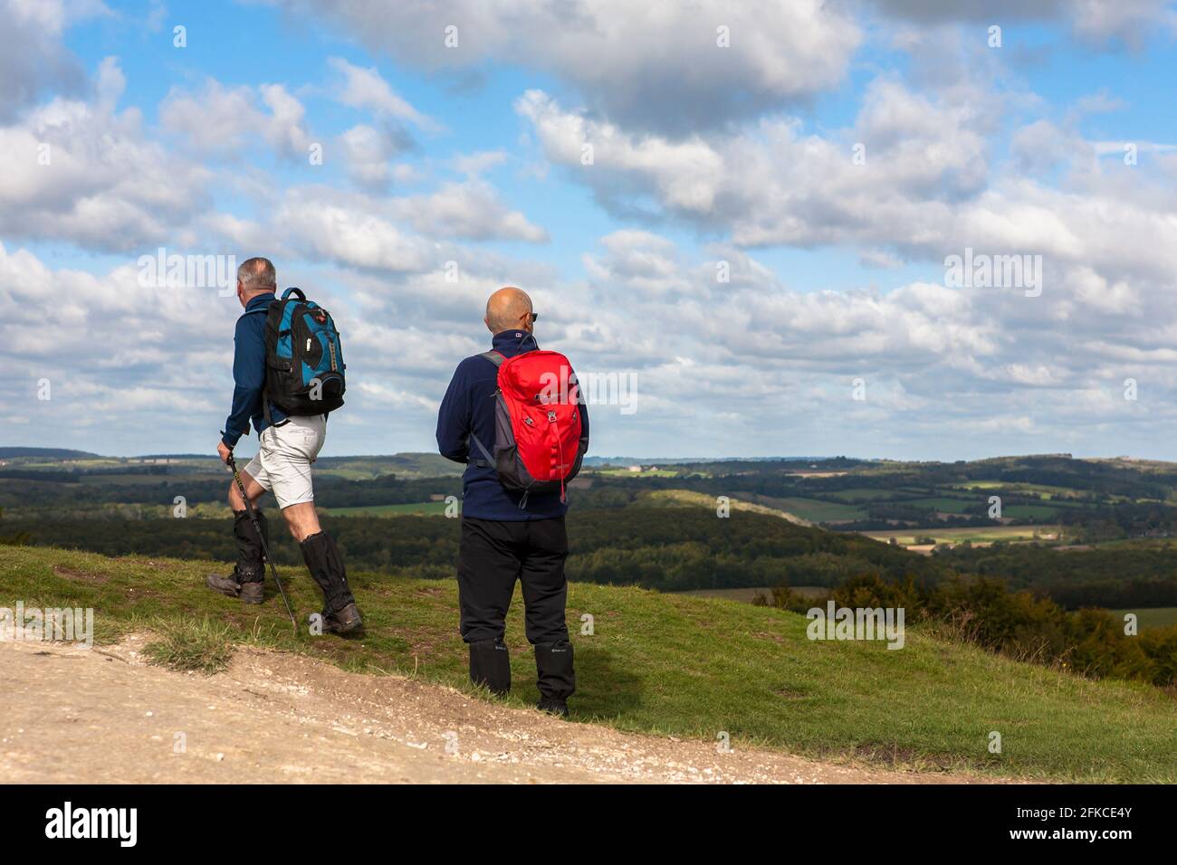 Two hikers admire the countryside in the South Downs National Park ...