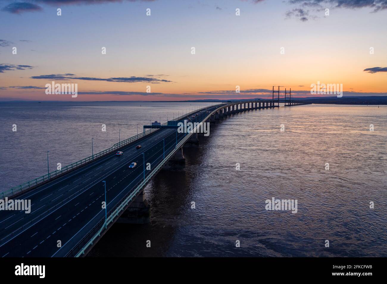 Severn Bridge crossing from England to Wales, at sunset. The bridge is ...
