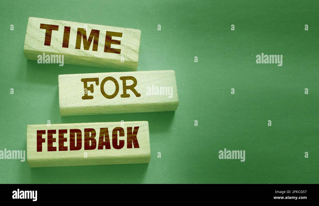 Time fir feedback text on wooden blocks. Product or service evaluation ...