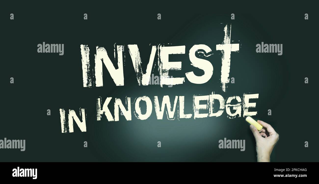 Invest in Knowledge writing, written with Chalk on Blackboard ...